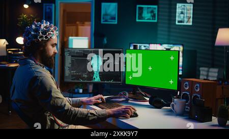 Developer using EEG headset, starting mind upload process using ...