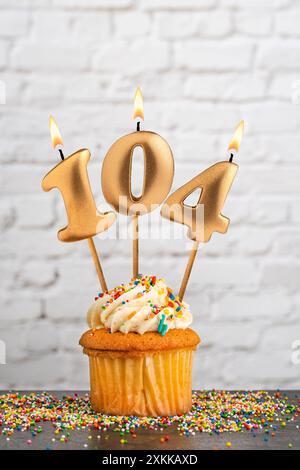 Golden number 104 birthday candle on white background Stock Photo - Alamy