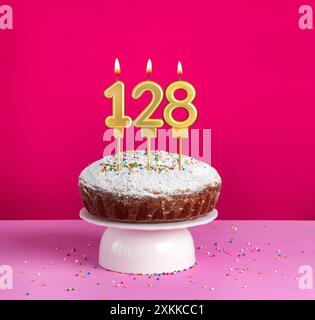Birthday card - Number 128 candle in orange background Stock Photo - Alamy