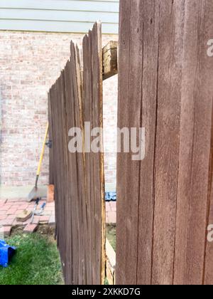 Backyard Wooden Fence with a Small Gap Between Panels Stock Photo - Alamy