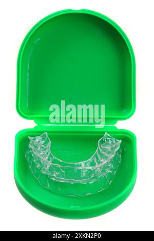 new plastic braces in the green box isolated Stock Photo - Alamy