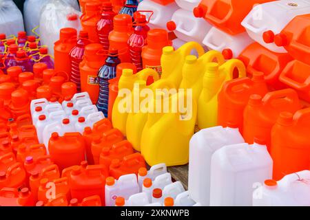 Different types of plastic cans are available to carry Ganga water in ...