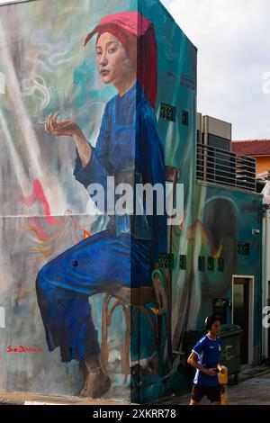 Wall mural of a beautiful Samsui woman holding a cigarette. Emit smoke ...