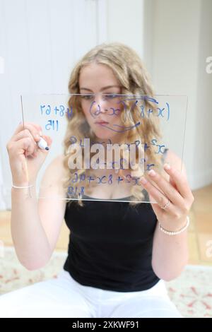 Whiteboard, math and girl writing for learning, studying and education ...