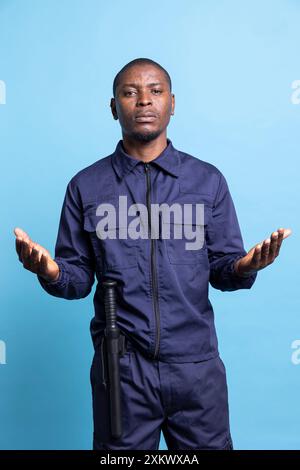 Confident spiritual guard praying to the Lord against blue background ...
