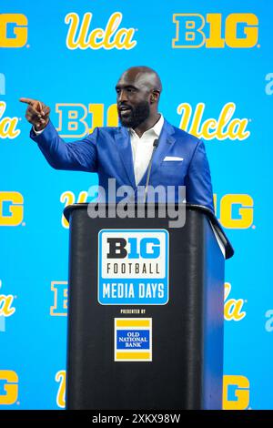 UCLA head coach DeShaun Foster has a discussion with officials during ...