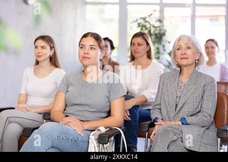 Interested women of different ages listening to master class Stock ...