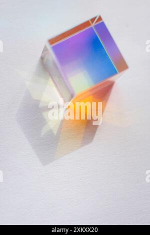 Glass cube with color spectrum rays. Abstract background with ...