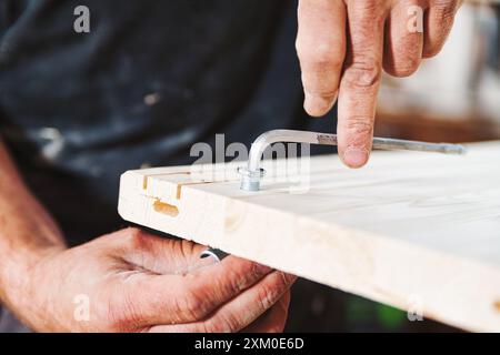Carpenter working wood surrounded by sawdust Stock Photo - Alamy