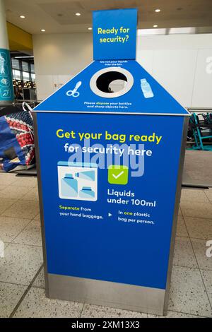 A sign displaying prohibited items at an airport security checkpoint ...