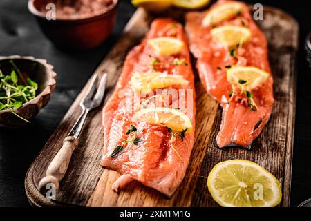 Grilled fillet of trout fish served with fresh vegetables and greens ...