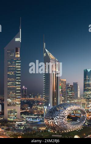 Museum of the Future with the Jumeirah Emirates Towers behind it. Dubai ...