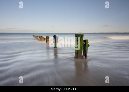 Youghal Strand Groynes on a warm summer evening Stock Photo - Alamy