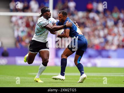 France's Varian Pasquet is tackled by Fiji's Raisuqu Josaia during the ...