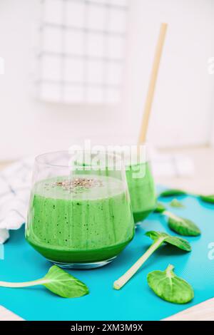 two glasses of Vegan detox green smoothie on a white table Stock Photo ...