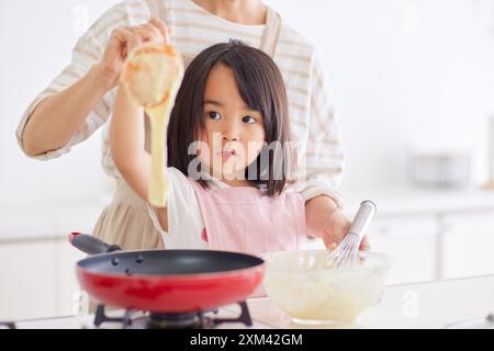 Japanese mother and daughter cooking in the kitchen Stock Photo - Alamy