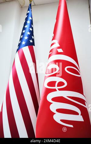 Two flags side by side, the USA and Coca Cola flags. At the CCI Coca ...