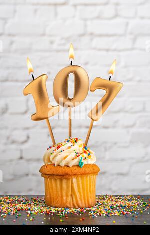 Golden candle number 107 - Birthday on white background Stock Photo - Alamy