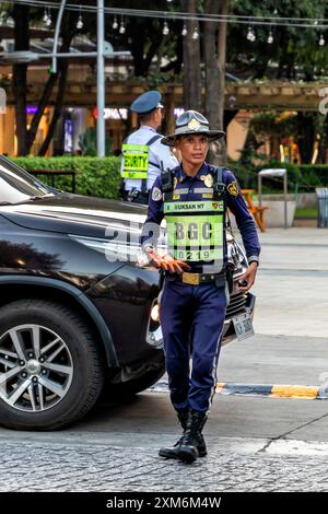 Traffic marshal controling vehicle movements, Bonifacio Global City ...