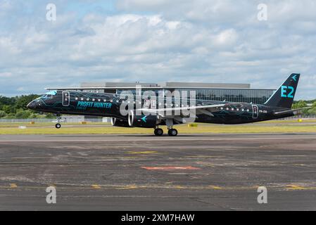 Embraer E195-E2 airliner named Profit Hunter landing at the Farnborough ...