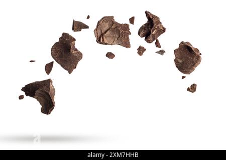Dark chocolate flakes falling, isolated on white background Stock Photo ...
