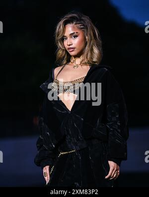 Tyla posing for photos on the red carpet at The Prelude to the Olympics ...