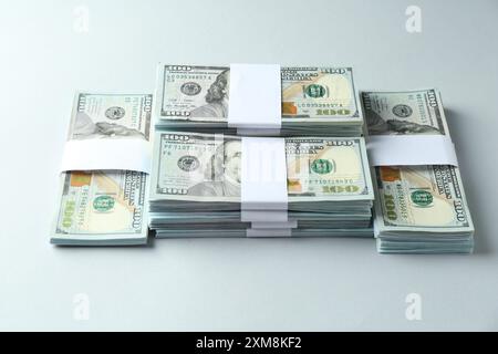 Bundles of dollar banknotes on light grey background Stock Photo - Alamy