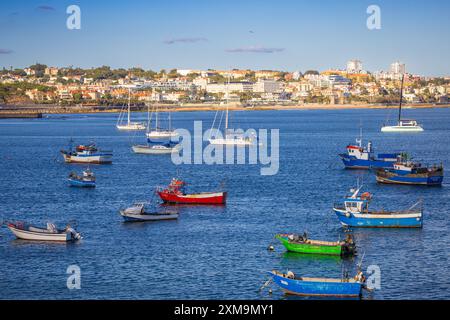 The port city of Cascais, Portugal. Buildings and a lighthouse on the ...