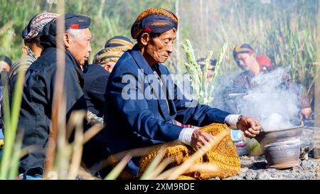 Javanese people pray during the Larungan ceremony on Mount Kelud Stock ...