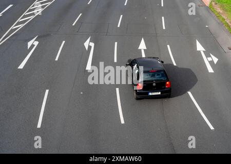 Road markings, turning lanes, directional signage at an intersection ...