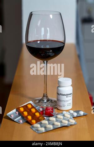 Symbolic image of alcohol and medication, you should not take medicine ...