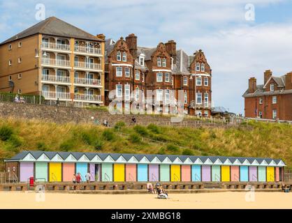 Colourful beach huts and historic clifftop buildings, South Beach ...