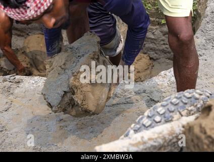 Workers digging clay in a brick factory, Sylhet Division, Bahubal ...