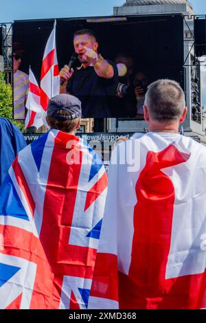 'Unite the Kingdom' march led by Tommy Robinson gathers hundreds of ...