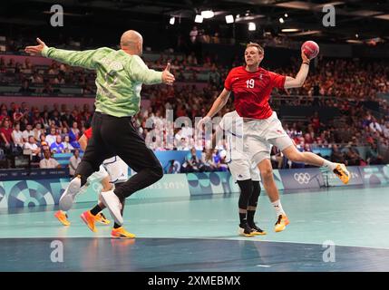 Mathias Gidsel (Denmark) shoots on goal during the men's Preliminary ...