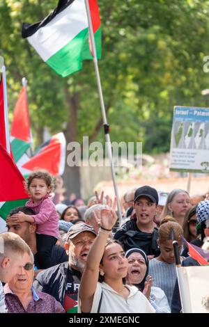 Crowd of people marching in demonstration in solidarity with Palestine ...