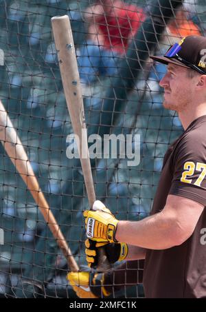 San Diego Padres' Bryce Johnson (29), Jackson Merrill, center, and ...