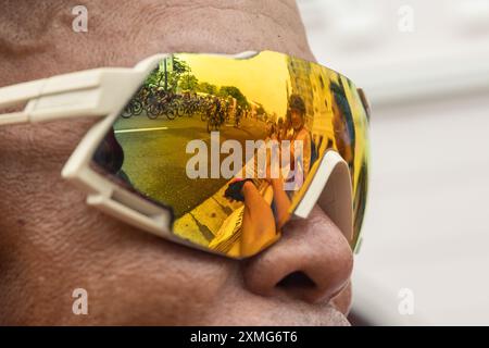 Iloilo City, Philippines. 28th July, 2024. Parents coach their children during a push bike race ...