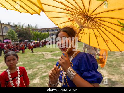 Chakma women with umbrellas in traditional clothing celebrating Biju ...