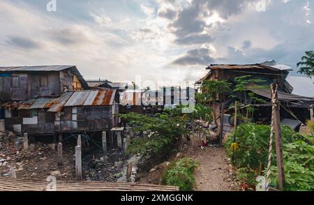 Life amidst challenges in a philippine slum community surrounded by ...