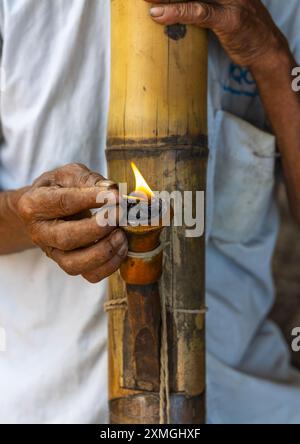 Chakma tribe man smoking bamboo pipe, Chittagong Division, Rangamati ...
