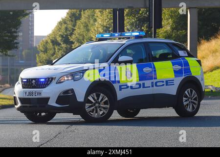 Vehicles from West Yorkshire Police Force used as roadblocks at a fire ...