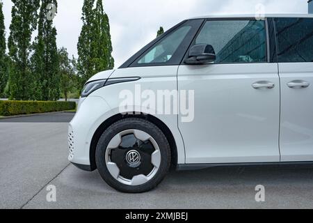 classic White electric bus Volkswagen ID Buzz charging, Old-school cool ...