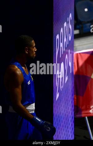 Belgian boxer Victor Schelstraete (blue corner) and Astrian boxer Ahmed ...