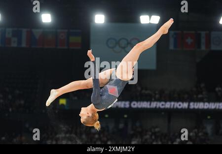 Alice Kinsella, of Great Britain, competes on the balance beam during a ...