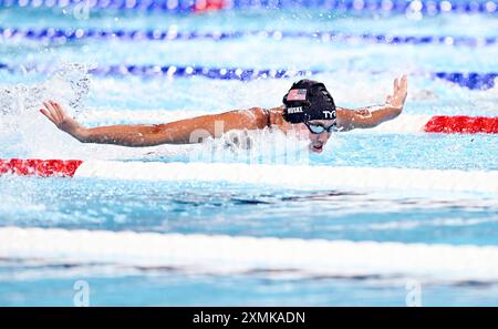 Torri Huske of the United States competes in the women's 100-meter ...