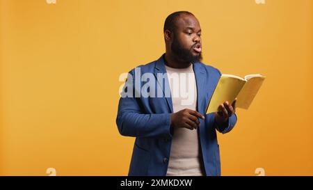 Man reading book aloud, narrating story for audience. Person enjoying ...
