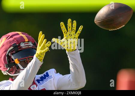 Washington Commanders wide receiver Olamide Zaccheaus (14) runs a pass ...