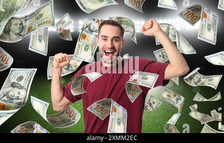Happy man under money shower at stadium Stock Photo - Alamy