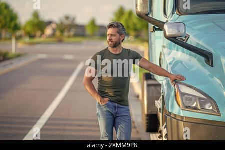Transportation vehicles. hispanic man posing in front of truck. Semi ...